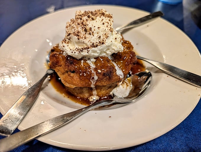 The bread pudding finale arrives like the encore at a concert you never want to end—warm, sweet, and topped with a cloud of whipped cream.