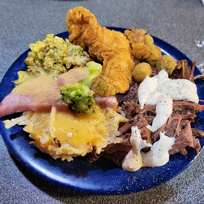 The art of buffet plate architecture on full display—a masterpiece of portion control defiance featuring at least three different proteins.