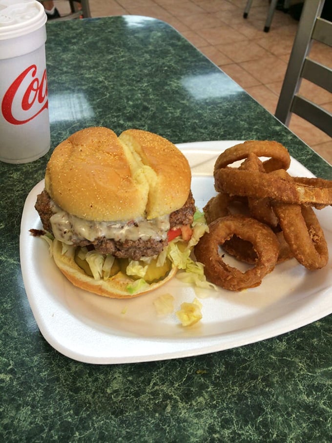 The classic American duo—burger and rings—sitting pretty on a plate. Some relationships are just meant to be.
