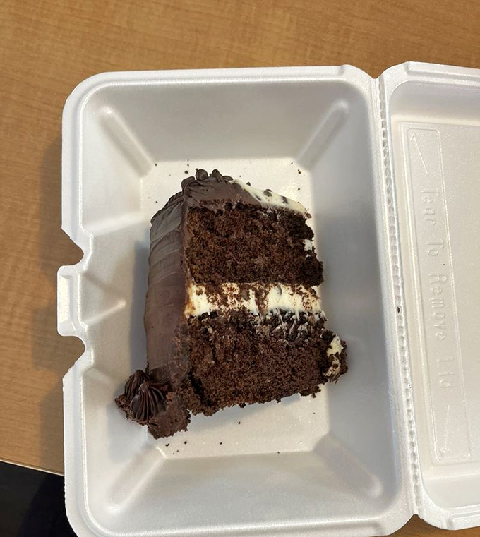 Chocolate cake that doesn't know the meaning of restraint. That layer of frosting in the middle isn't just generous—it's downright philanthropic.