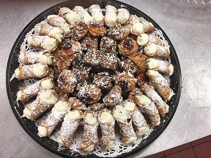 The grand finale: a platter of cannoli with crisp shells and creamy filling – the Italian-American dessert that makes you save room no matter how much pizza you've eaten.