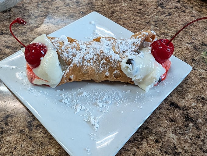 The cannoli—a sweet finale that whispers, "See you again soon." Crisp shell, creamy filling, and those cherries are just showing off.