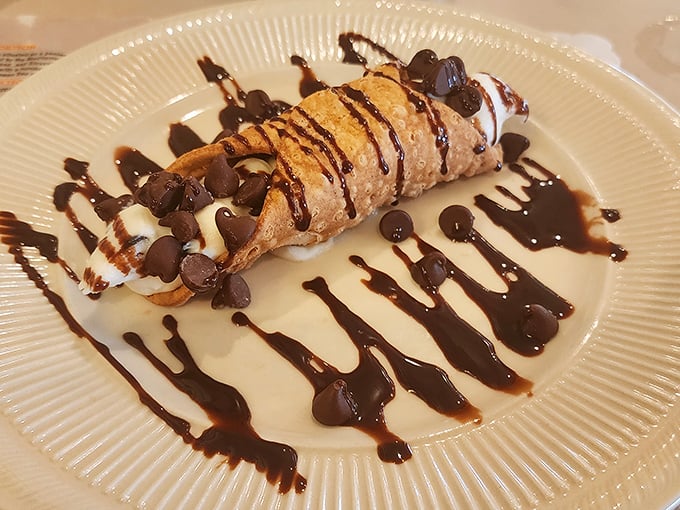 The cannoli—crisp shell, sweet filling, chocolate chips, and a drizzle that makes you wonder why you'd ever waste calories on lesser desserts.