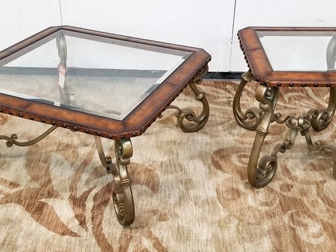 These glass-topped tables with ornate metal bases aren't just furniture—they're conversation pieces that say "Yes, I have excellent taste" without you having to say a word.