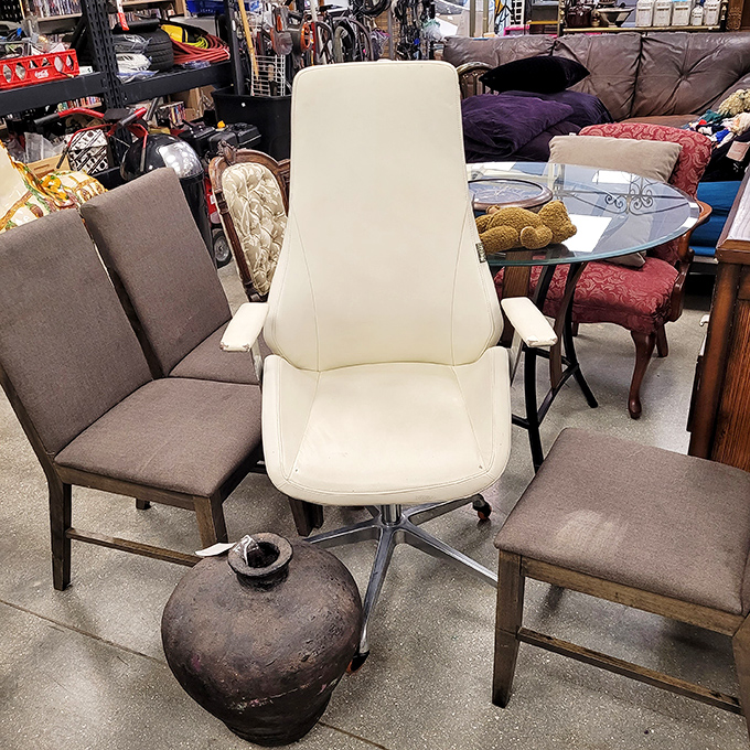 That white office chair isn't just seating—it's your next work-from-home promotion, surrounded by its more casual dining chair colleagues.
