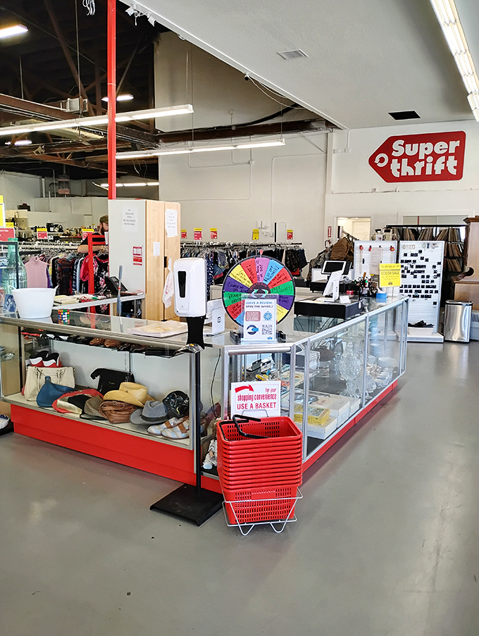The checkout counter—final gateway between thrift store dreams and reality, complete with impulse-buy treasures and a spinning wheel of additional discounts.