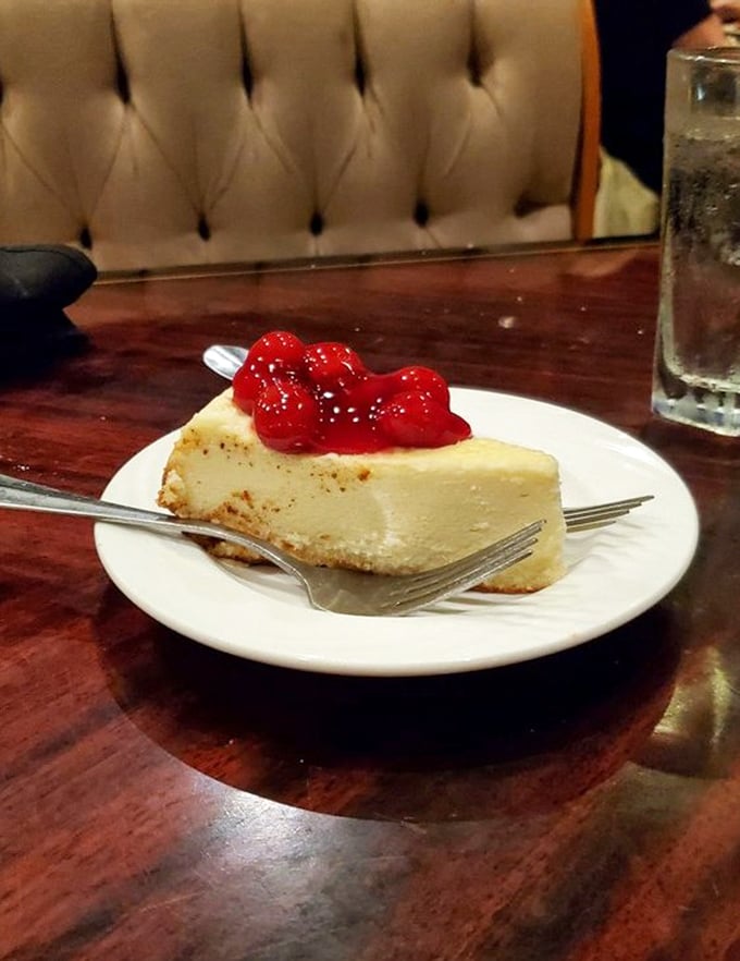 New York cheesecake topped with cherries—dense, rich, and unapologetic. The kind of dessert that makes you reconsider your belt notch.