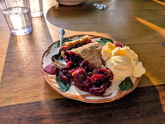 Cherry pie that captures Michigan's soul on a plate. With ice cream melting into warm fruit, it's the sweet finale every lake adventure deserves.