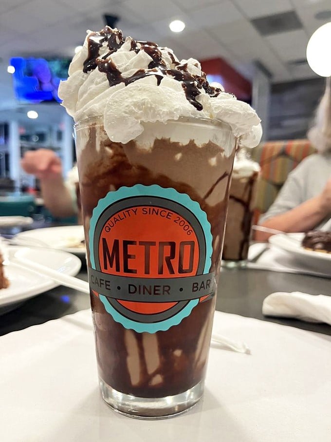 This isn't just a milkshake—it's a tower of chocolate commitment topped with whipped cream architecture. Diet plans weep at the sight.