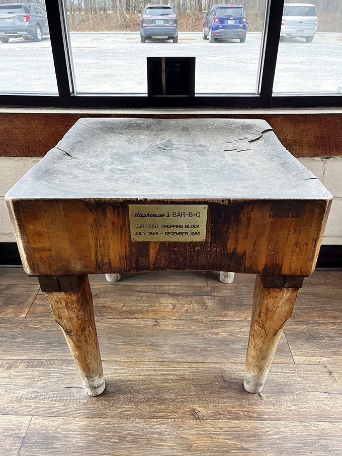 This chopping block has seen more action than a Hollywood stuntman, its weathered surface a testament to barbecue history.