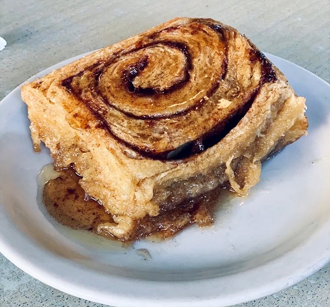 This cinnamon roll isn't just breakfast, it's an event – layers of buttery dough and spiced sugar swirls melting together in sweet, gooey harmony.