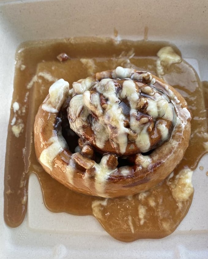 This cinnamon roll isn't just dessert disguised as breakfast – it's a gooey, warm hug on a plate that makes everything right with the world.
