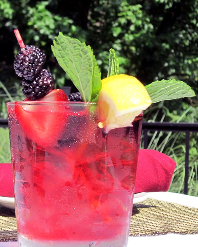 Summer in a glass—berries, mint, and citrus come together in this cocktail that's basically a vacation you can sip through a straw.