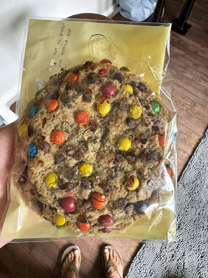 This isn't just a cookie—it's a handheld celebration studded with M&Ms that brings out the kid in everyone who takes a bite.