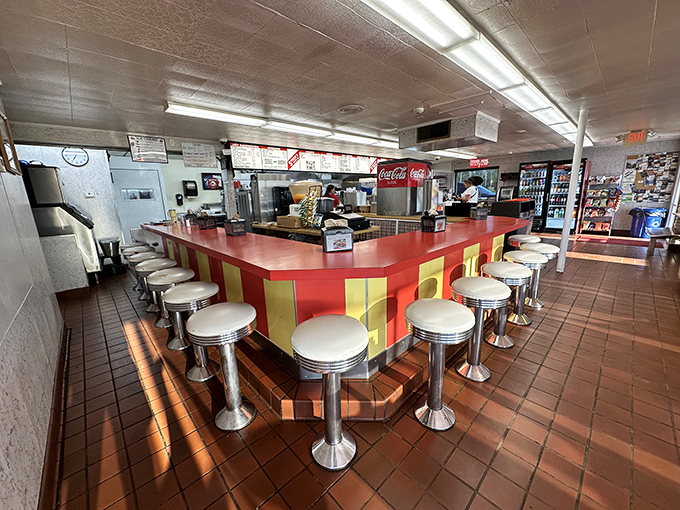 The counter where magic happens—complete with classic diner stools that invite you to spin exactly once before settling in for a meal you won't forget.
