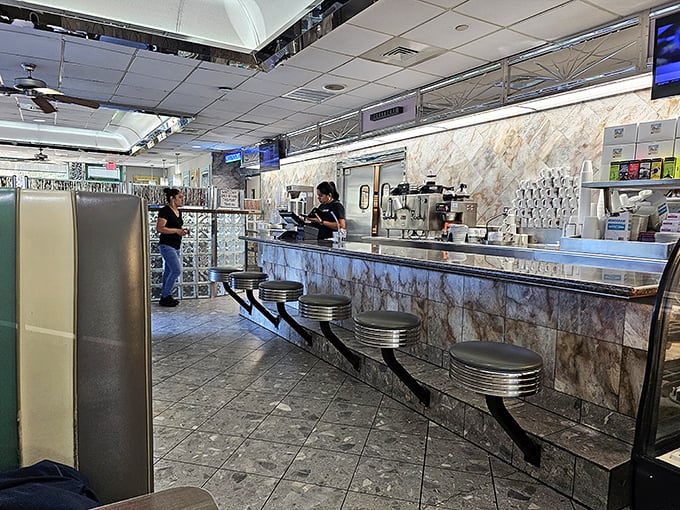 The counter where breakfast magic happens, complete with classic swivel stools—the front-row seats to the greatest show on Hilton Head: breakfast.
