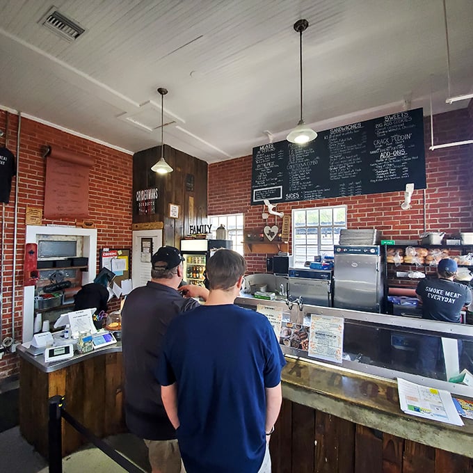 The moment of anticipation at the counter – like waiting for curtains to rise on a Broadway show, except the stars are smoked meats and the tickets are deliciously affordable. 