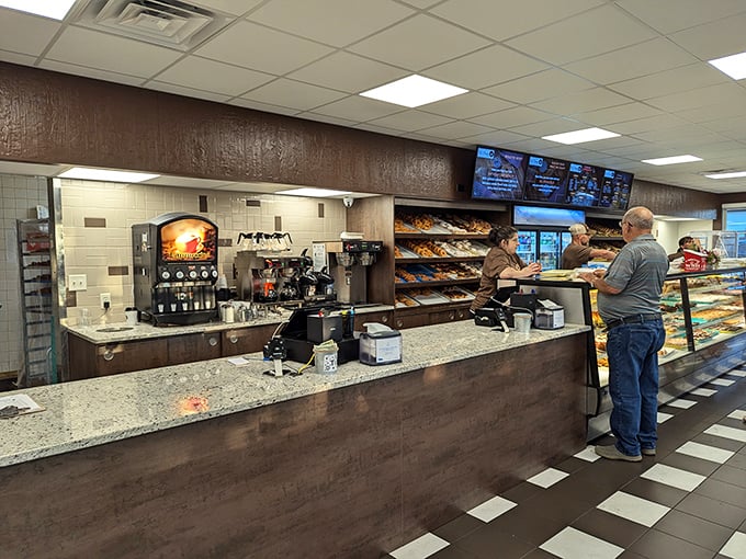 The counter where magic happens—where strangers become regulars and regulars become family, one donut transaction at a time.