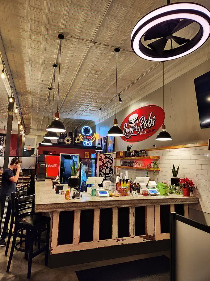 Counter dining with a view of burger magic happening – like watching artists at work, except you get to eat the masterpiece.