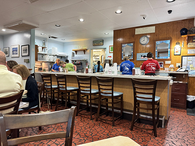 The counter seats: where regulars become family and first-timers get schooled in seafood perfection. Notice those distinctive terra cotta floors—pure Florida.