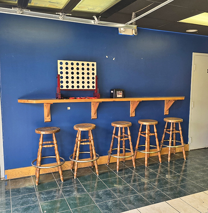 The blue wall and wooden stools create the perfect perch for pizza contemplation. Connect Four included for pre-meal entertainment.