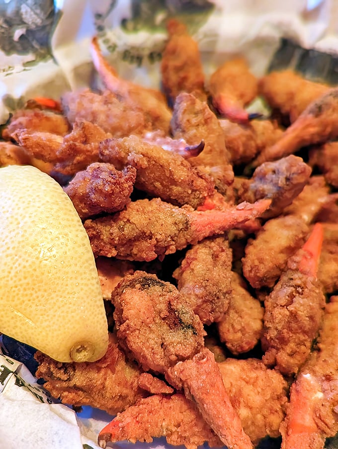 These golden-fried crab claws aren't just appetizers—they're edible treasure. The crunch gives way to sweetness that makes you forget your table manners entirely.