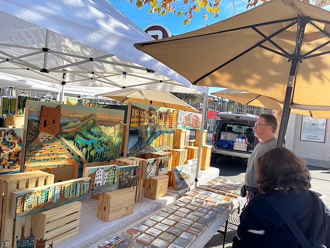 Handcrafted wooden art pieces line this booth like a gallery where you're actually encouraged to touch the merchandise—and take it home.