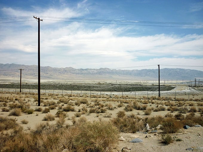 The white expanse of Searles Dry Lake stretches toward distant mountains—a mineral-rich canvas that has sustained Trona through decades of boom and bust.
