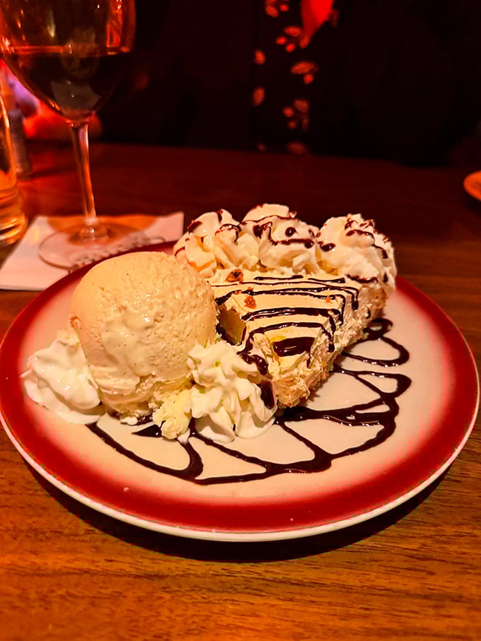 Cheesecake and ice cream sharing a plate like old friends catching up. The chocolate drizzle is their fascinating conversation you get to overhear.