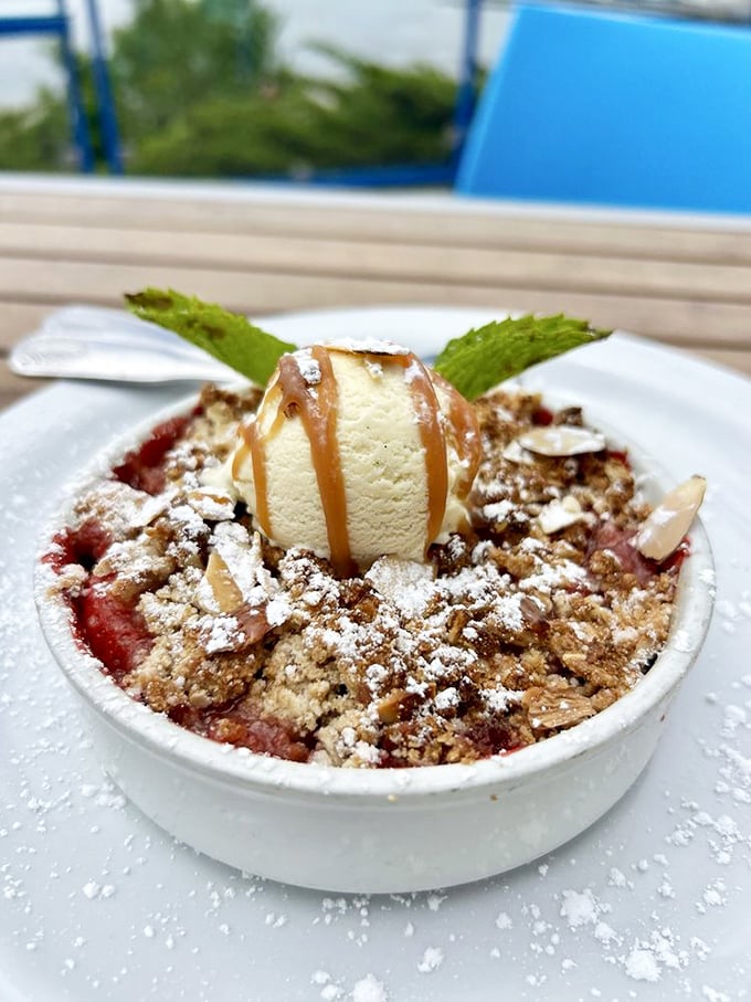 This isn't just dessert—it's the final act in a coastal culinary performance. Warm fruit, crumbly topping, and ice cream melting into sweet surrender.