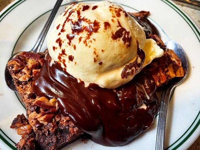 Bread pudding with chocolate sauce and ice cream—the holy trinity of dessert that makes you consider ordering seconds before finishing firsts.