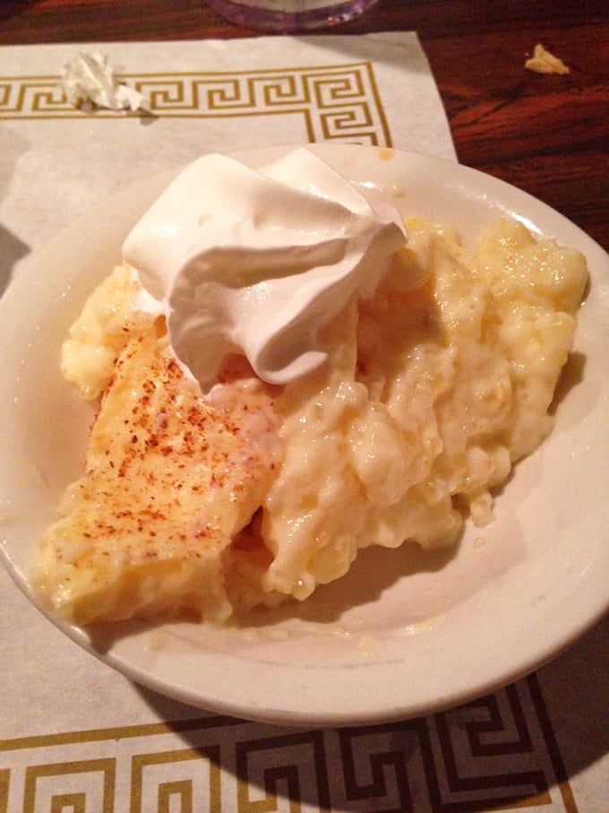 Homemade rice pudding with a sprinkle of cinnamon and a dollop of whipped cream. The sweet finale that has ended countless memorable meals.