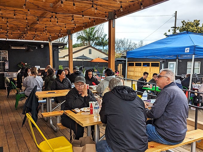 The universal language of barbecue brings people together. These diners aren't talking much—their mouths are otherwise occupied.