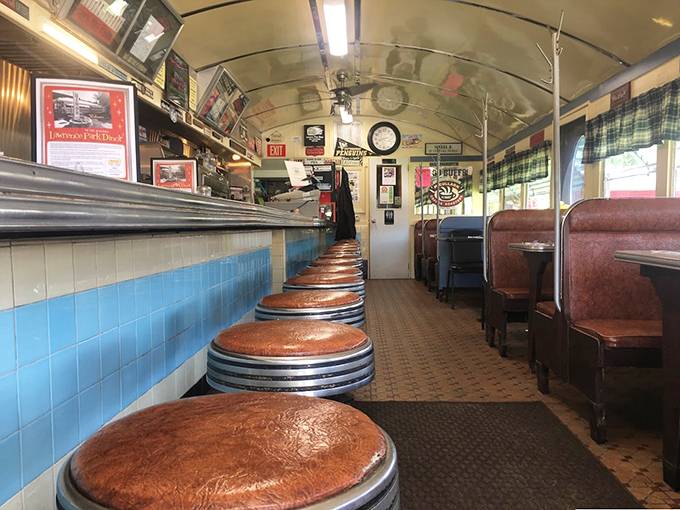 The row of empty stools awaits the morning rush—each one holding stories of countless conversations and coffee refills.