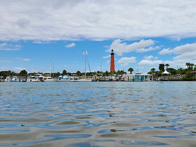 From water level, the lighthouse stands like a slender exclamation point against Florida's blue canvas, a sentinel visible to boaters and daydreamers alike.