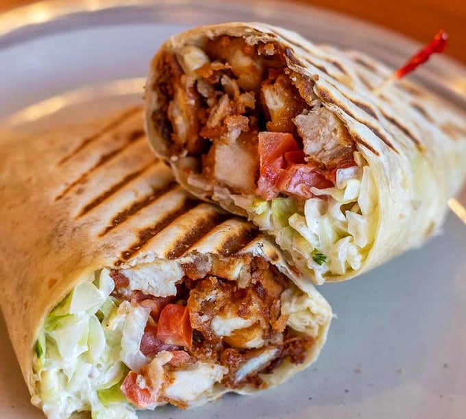 This wrap, sliced to reveal its treasure trove of fillings, proves that good things come in bundles. A portable feast of flavors and textures.