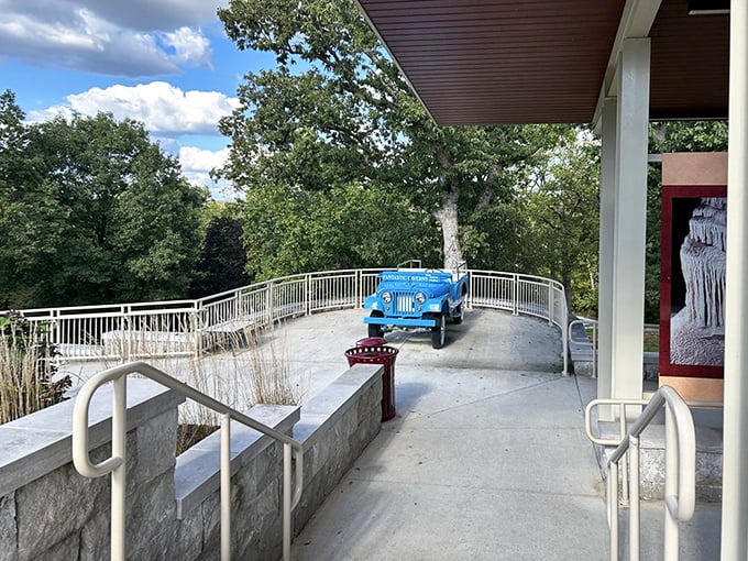 The iconic blue Jeep-drawn tram awaits its next underground expedition. Like a subterranean safari vehicle, minus the risk of being chased by lions.