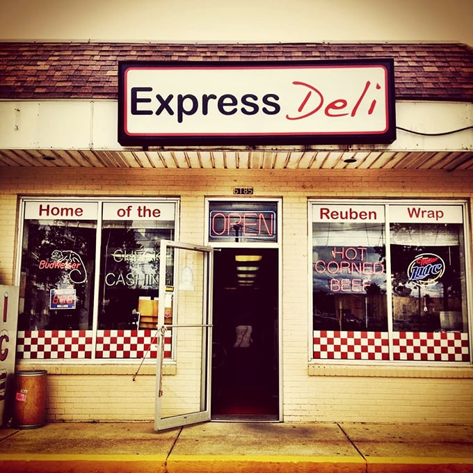 Not all heroes wear capes—some have "OPEN" signs and "HOT CORNED BEEF" in neon. This entrance promises more satisfaction than most fancy restaurants.