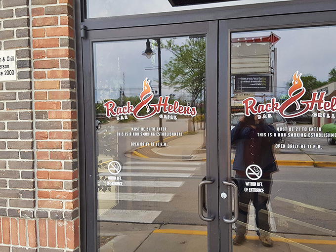 "Must be 21 to enter" – three words that signal adult pleasures await. The reflection captures both the restaurant and the anticipation of what's inside.