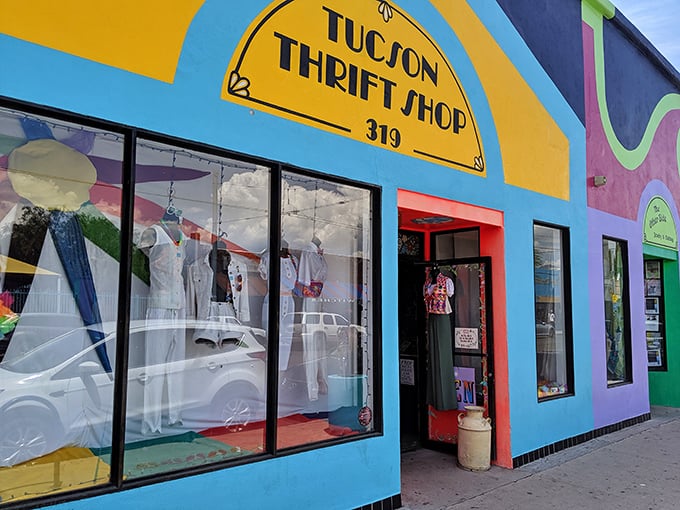 The entrance to Tucson Thrift Shop stands like a portal to fashion adventures—step through the red doorway and leave your fashion inhibitions behind.