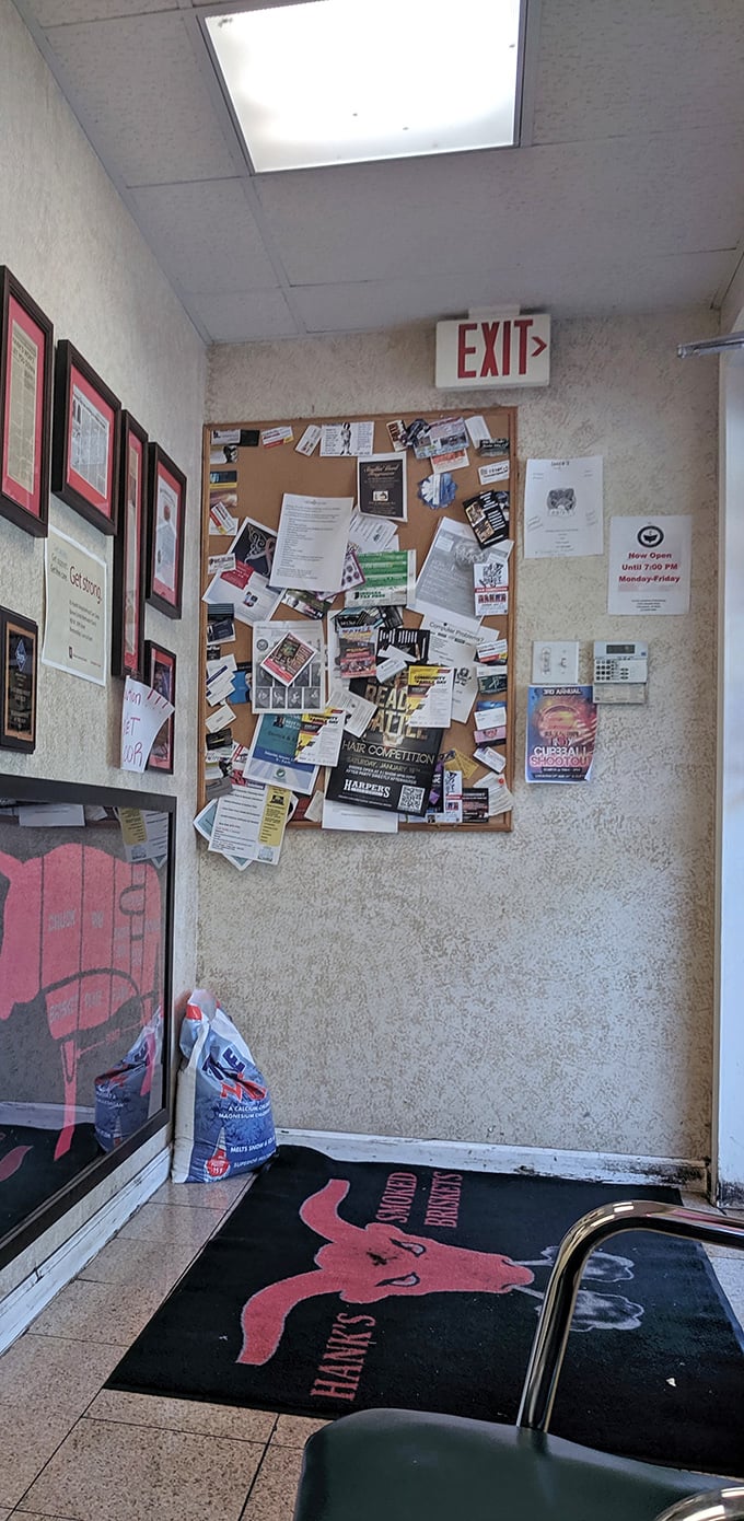 A bulletin board plastered with community notices and a branded mat—the kind of authentic touches that tell you this place is woven into the neighborhood fabric.