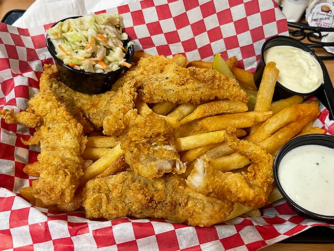 Fish and chips that would make a British pub regular nod in solemn approval. The coleslaw isn't just a side—it's the referee in this crunchy-creamy matchup.