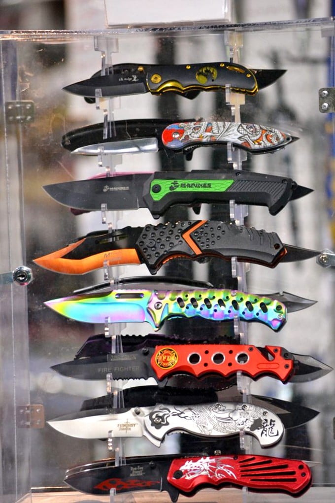 Pocket knives displayed like fine jewelry—practical tools transformed into collectible art pieces with personality to spare.