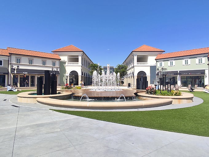 This fountain plaza isn't just pretty—it's strategic. The soothing sounds of water help calm your credit card anxiety between stores. 