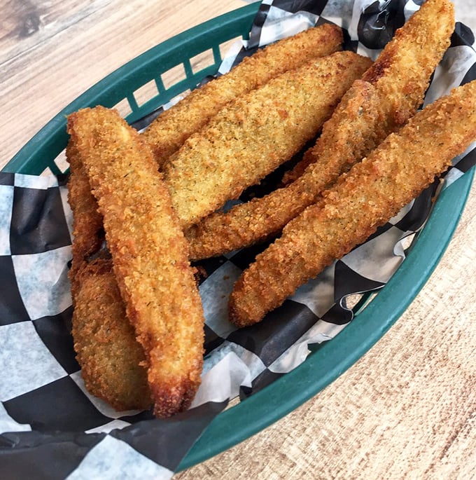 Fried pickles that crunch loud enough to turn heads. These golden spears deserve to be fought over by everyone at your table.