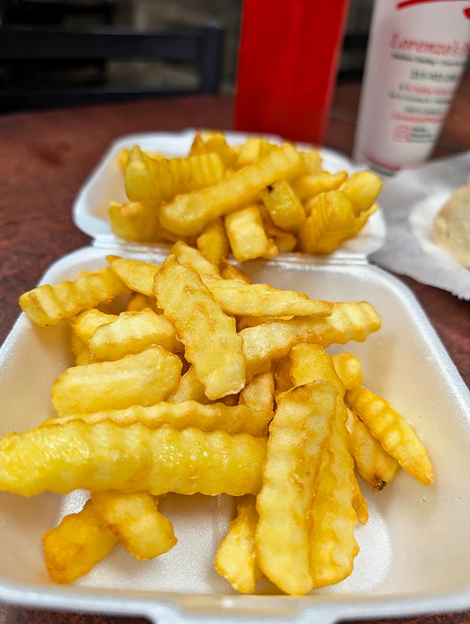 Golden, crispy fries that crackle with each bite—the perfect supporting actor to Lorenzo's star sandwich attractions.