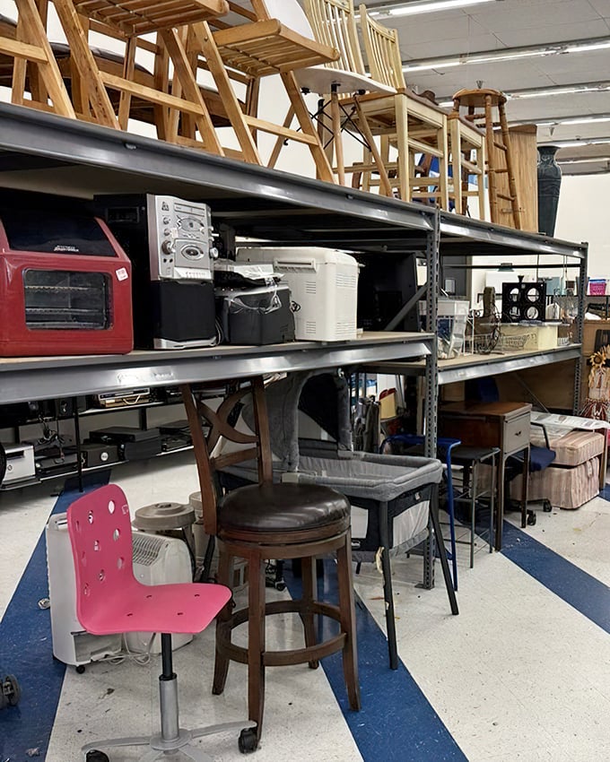 The furniture section is like a time capsule with seating. That pink chair has definitely seen some 1990s homework sessions.