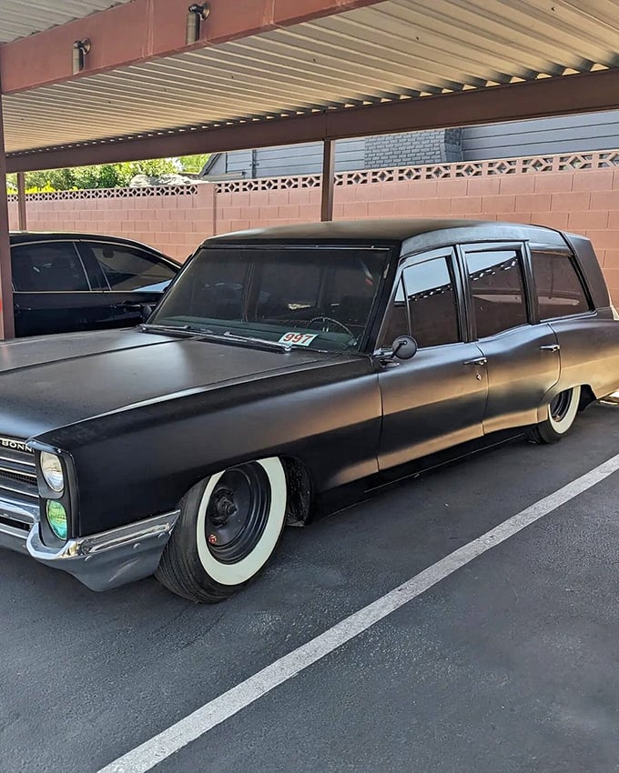 The museum's vintage hearse—because nothing says "authentic haunted experience" like the last ride many took to their eternal rest. 