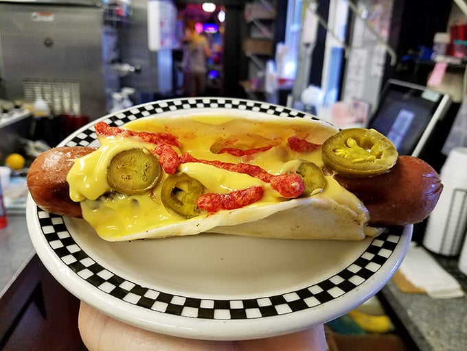 The hot dog taco—when two beloved foods decide to elope. Jalapeños and cheese sauce make this union spicy, melty, and worthy of your immediate attention.