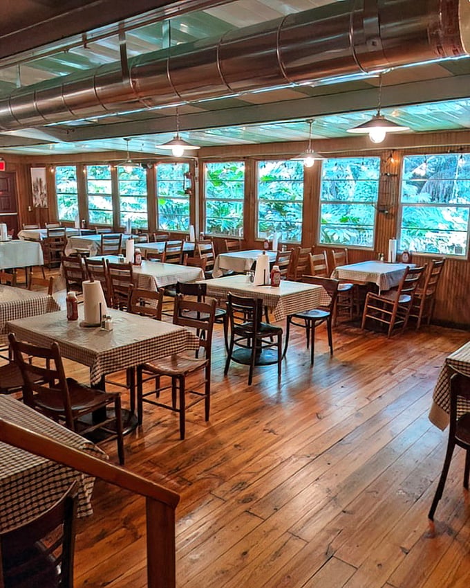 Sunlight streams through windows onto wooden floors that have supported generations of seafood lovers – a dining room that feels like coming home.